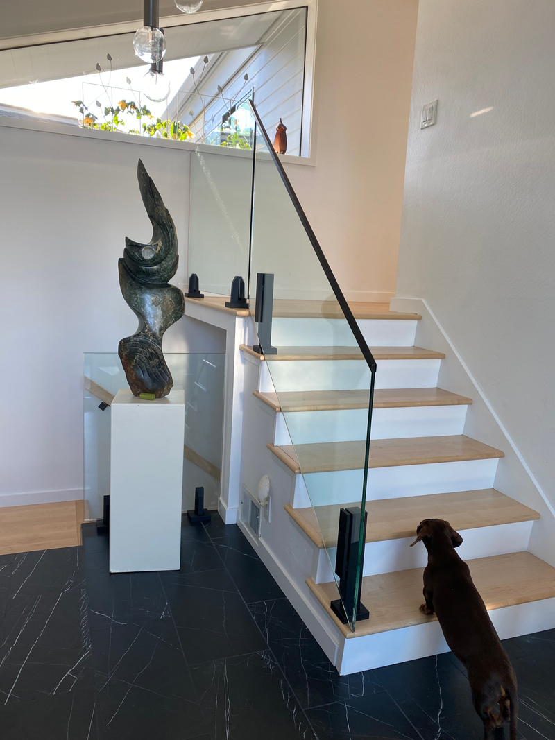 Glass railing with top rail mounted with Standoffs. Matte black finish ...