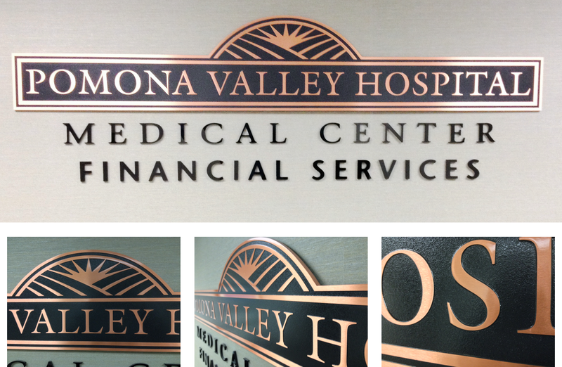 Interior bronze reception sign - leaf signs